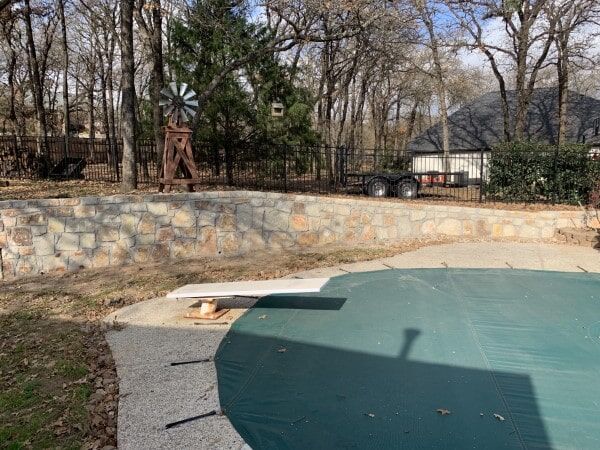 Replaced Wood Retaining Wall with Milsap Stone in Burleson