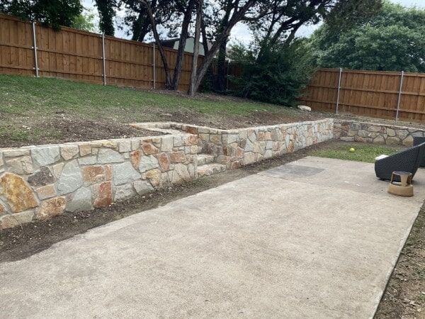 Replaced old crosstie wall with Milsap stone wall in Dallas, TX