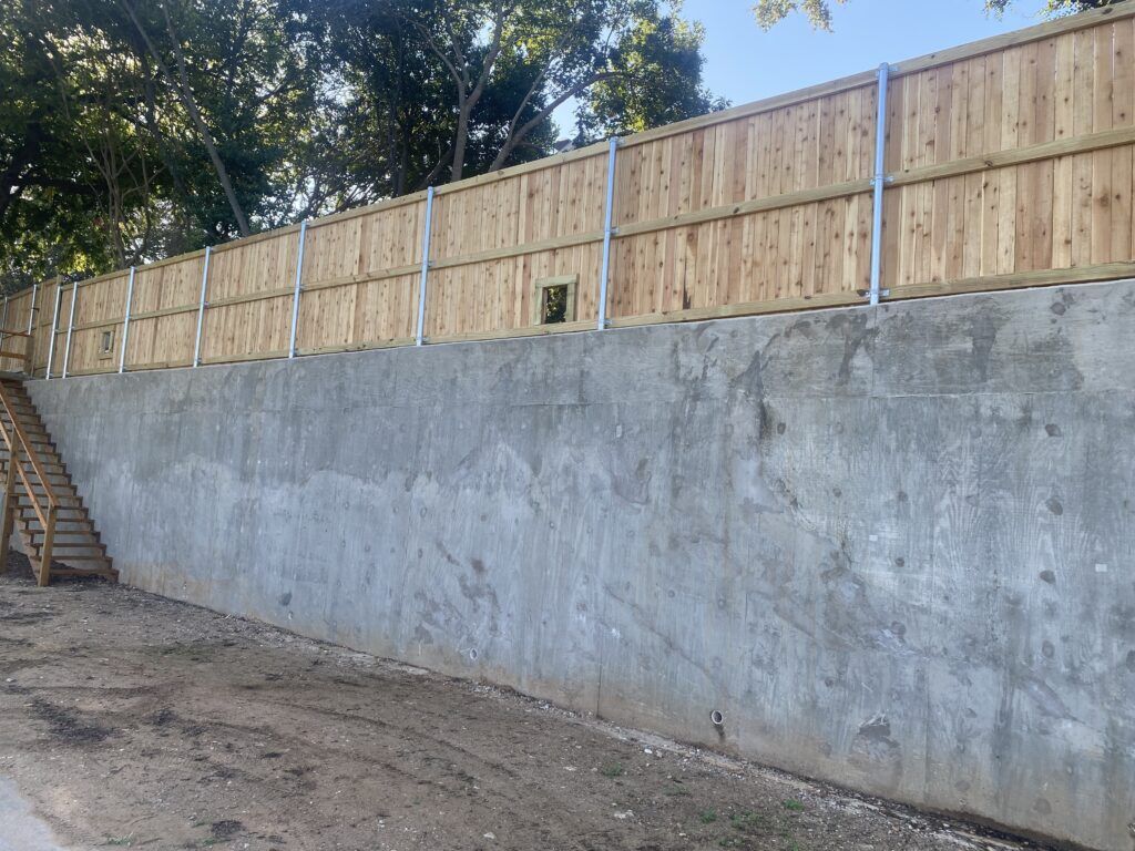 Our Latest Concrete Retaining Wall with Fence - DFW Retaining Walls and ...