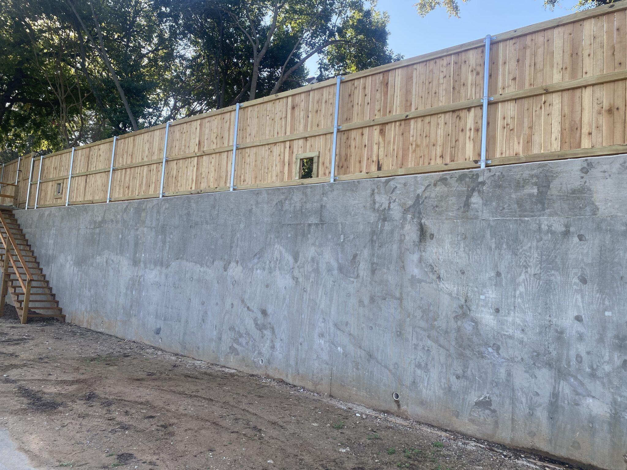 Our Latest Concrete Retaining Wall with Fence - DFW Retaining Walls and ...